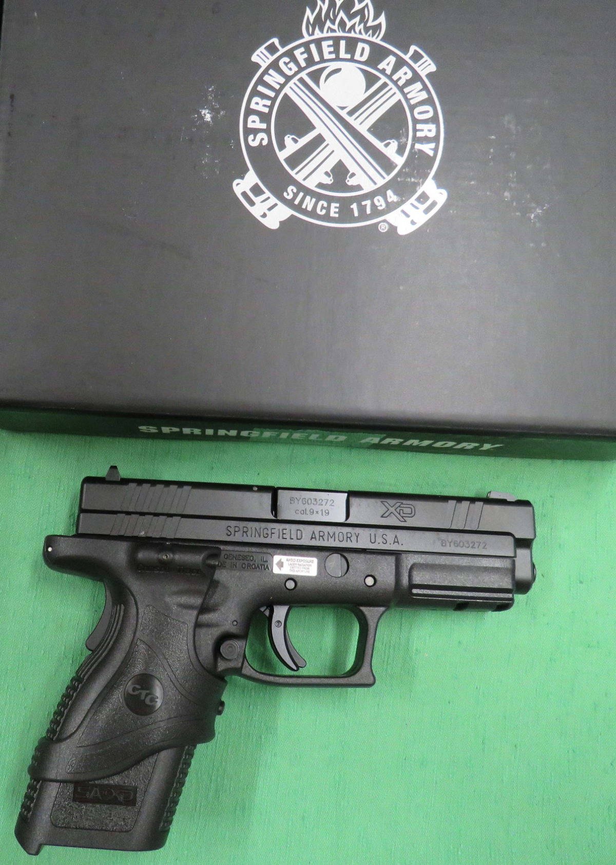 Springfield Armory XD Defender 9mm pistol with Crimson Trace red laser ...